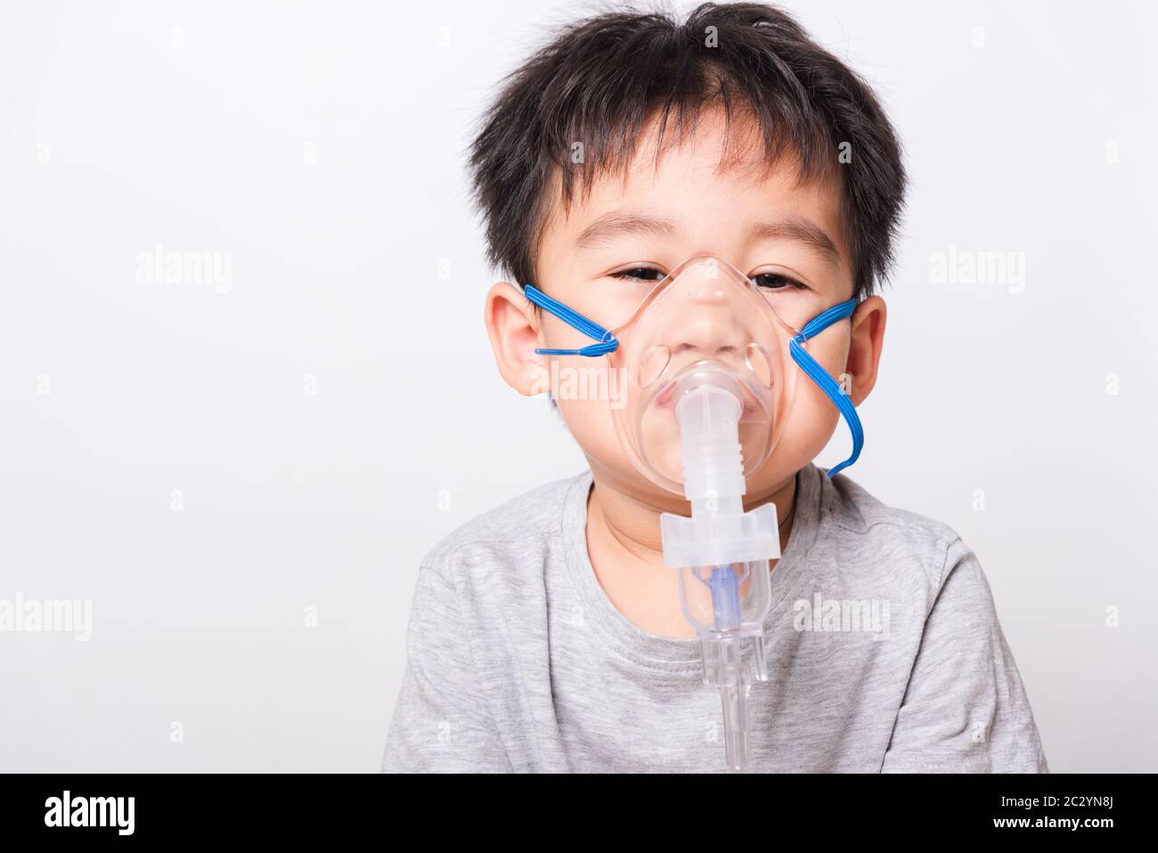 Closeup Asian face, Little children boy sick he using steam inhaler ...