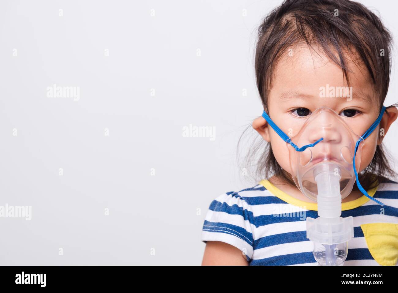 Closeup Asian face, Little baby girl sick her using steam inhaler ...
