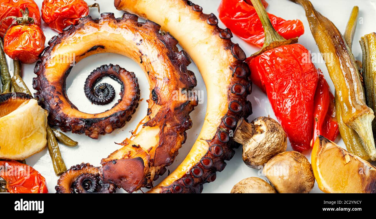 Grilled tentacle octopus with roasted vegetables.Cooked octopus Stock ...