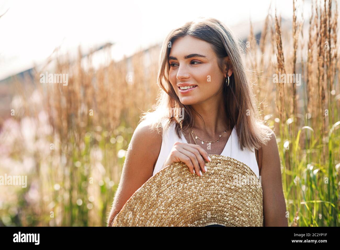 Woman standing outdoors hi-res stock photography and images - Alamy