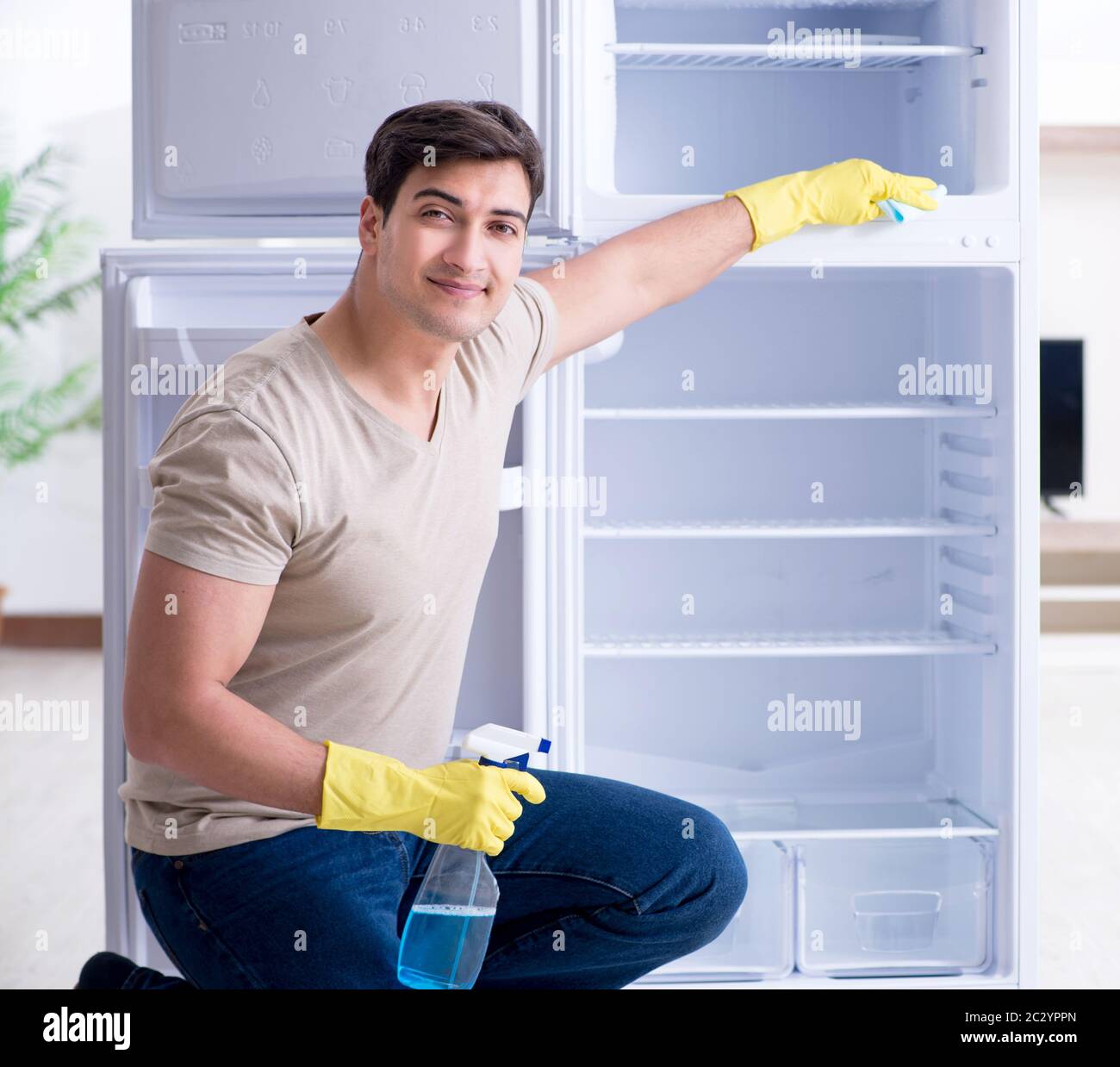 Man cleaning fridge in hygiene concept Stock Photo - Alamy