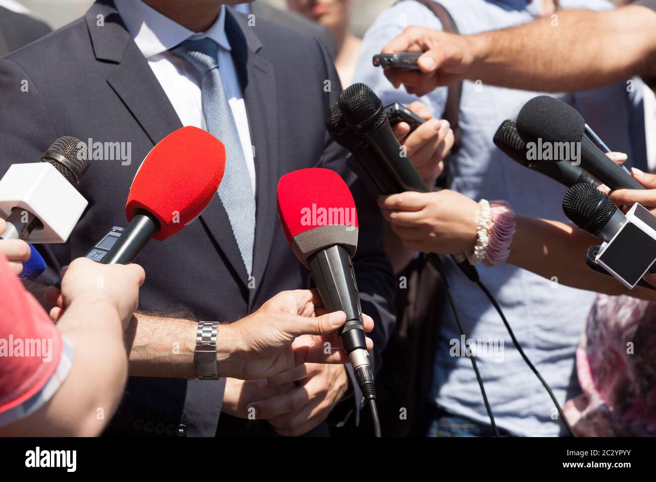 Press interview. Broadcast journalism. Microphone Stock Photo - Alamy