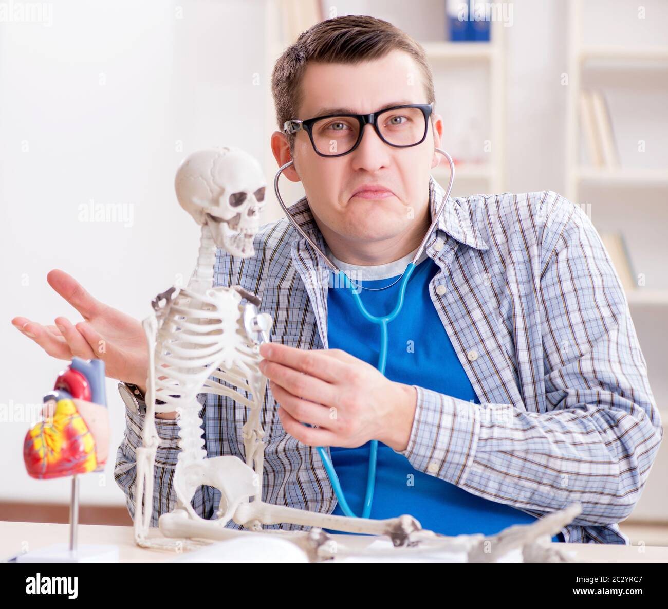 Medical student studying skeleton in classroom during lecture Stock ...