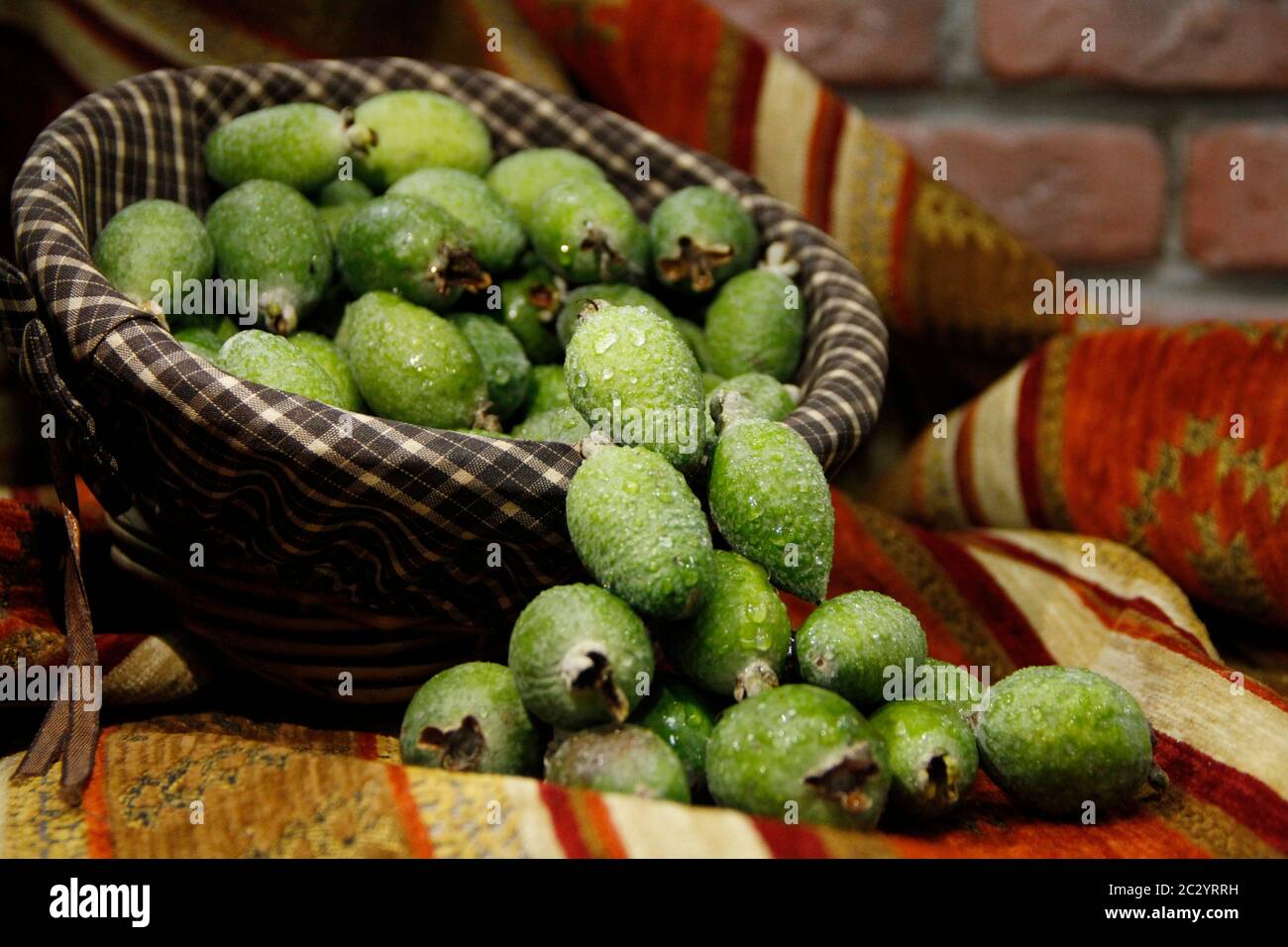 Green feijoa fruits on the ethnic tablecloth Stock Photo - Alamy