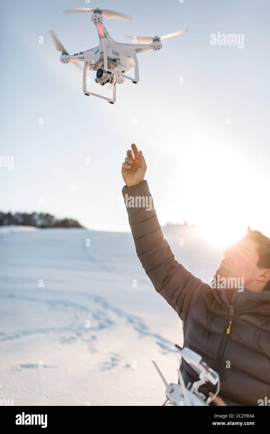 Drone operator holding transmitter control hi-res stock photography and images - Alamy