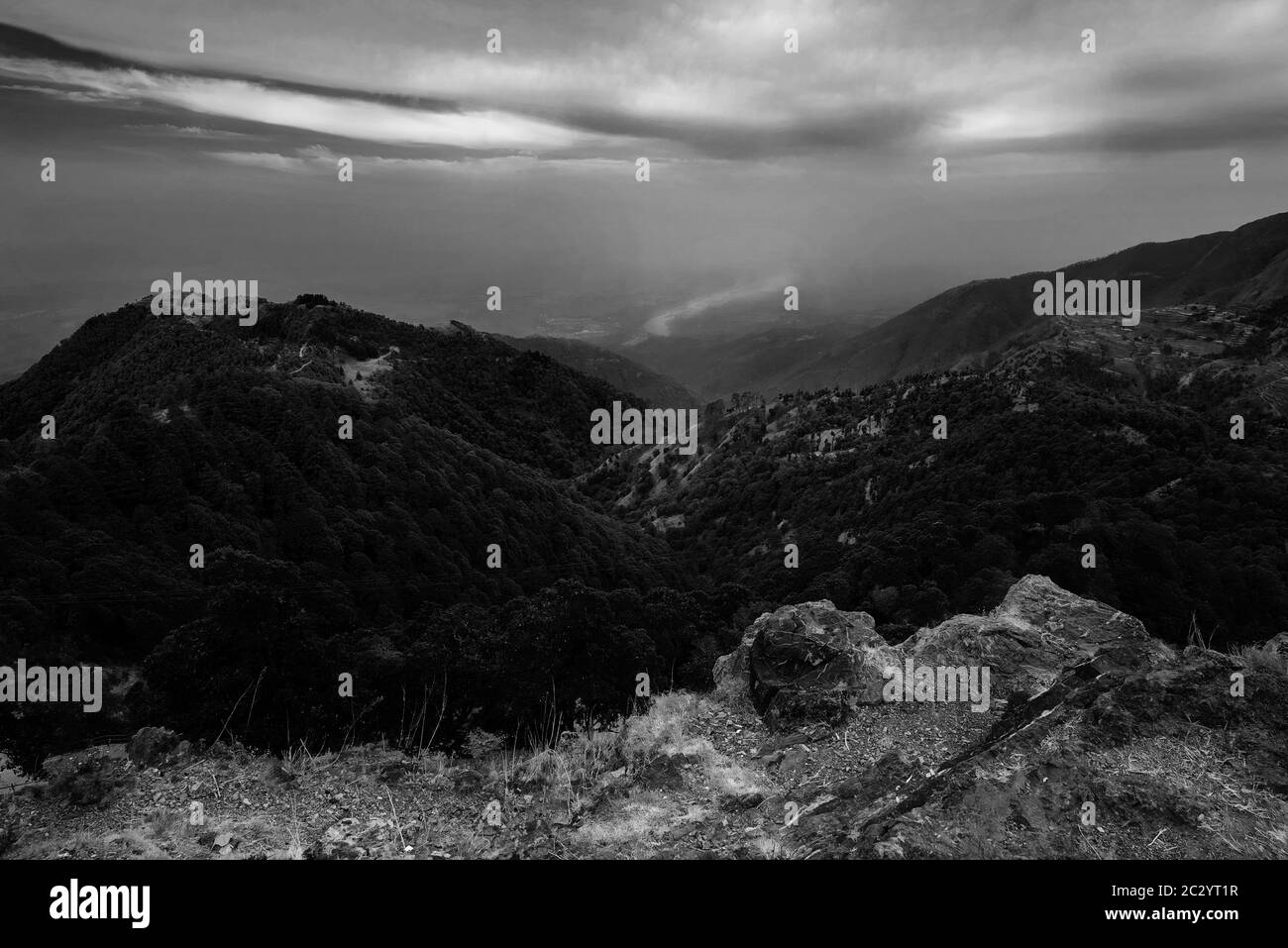 Dramatic mountain scene with dark clouds and valley Stock Photo - Alamy