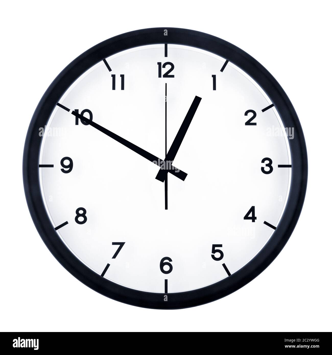 Classic analog clock pointing at twelve fifty, isolated on white ...