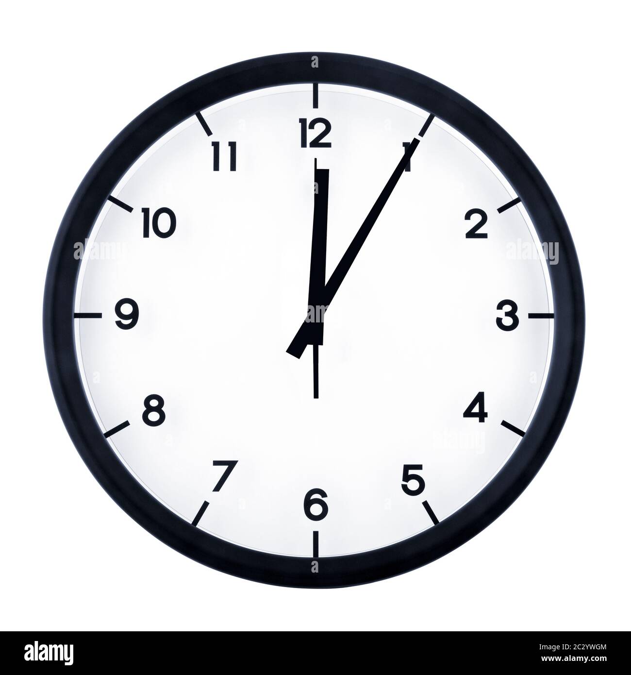 Classic analog clock pointing at twelve O five, isolated on white ...