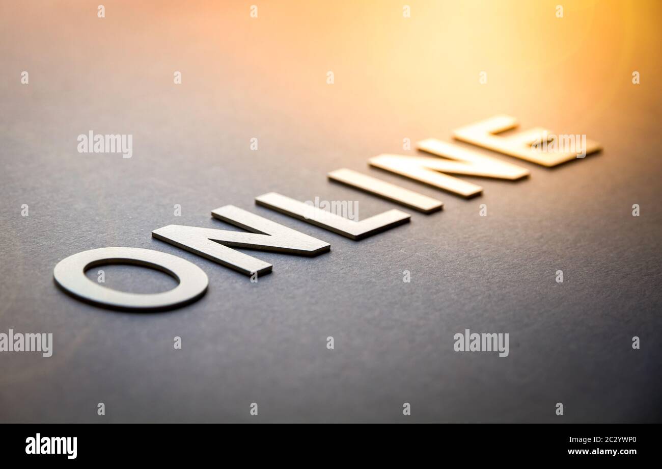 Word online written with white solid letters on a board Stock Photo - Alamy