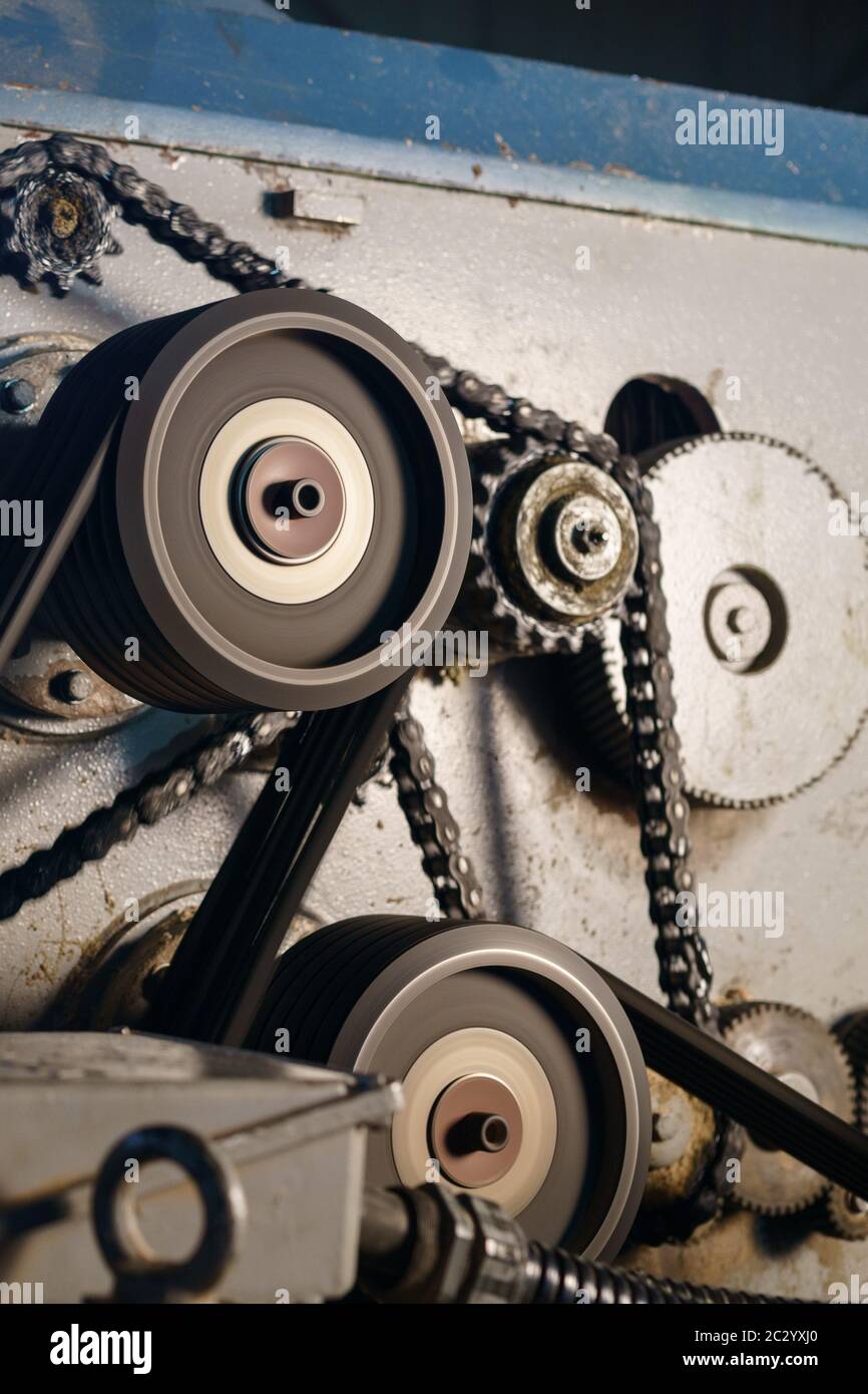 Close-up of rotating gears on running machine Stock Photo - Alamy
