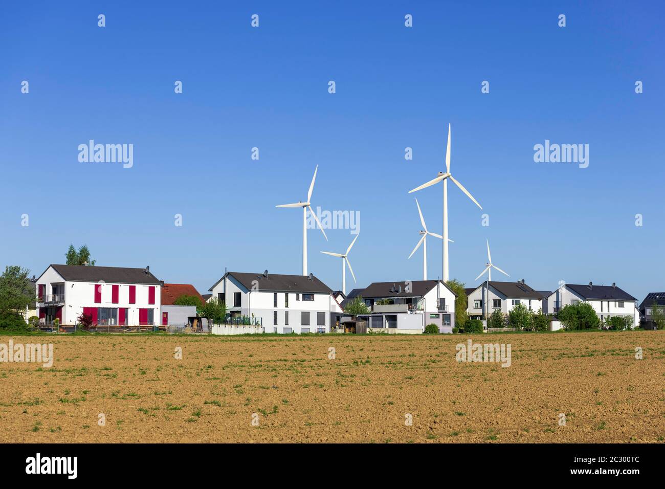 Digital Composing, new housing estate with wind turbines, wind power ...