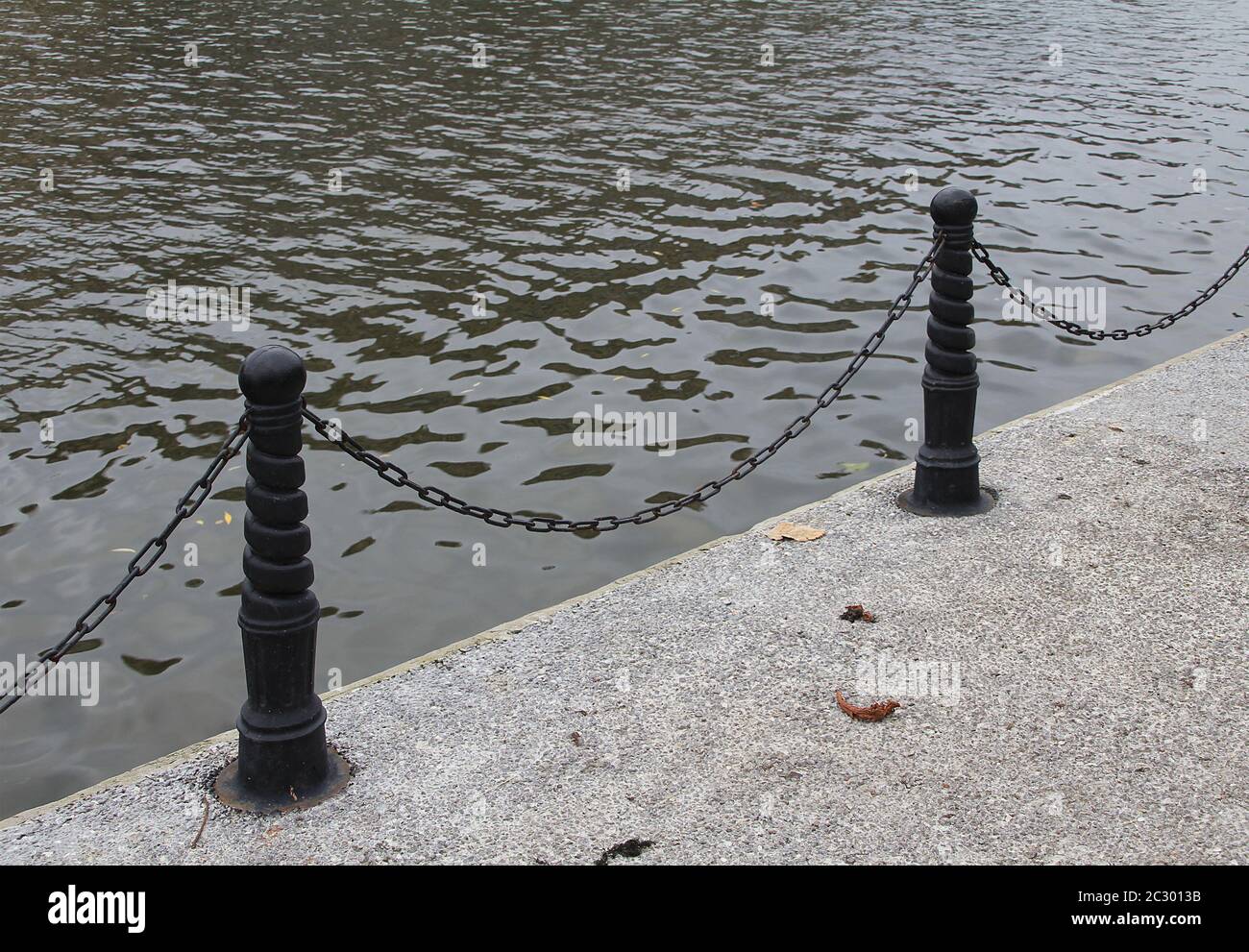 Metal fence on the embankment of the river Stock Photo - Alamy