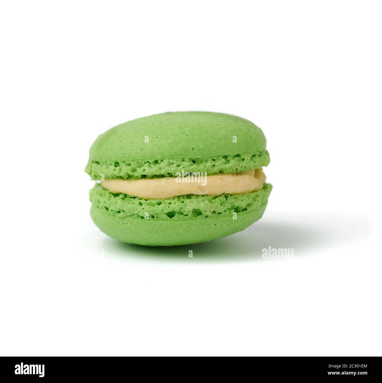 green round baked almond flour macaron isolated on a white background ...
