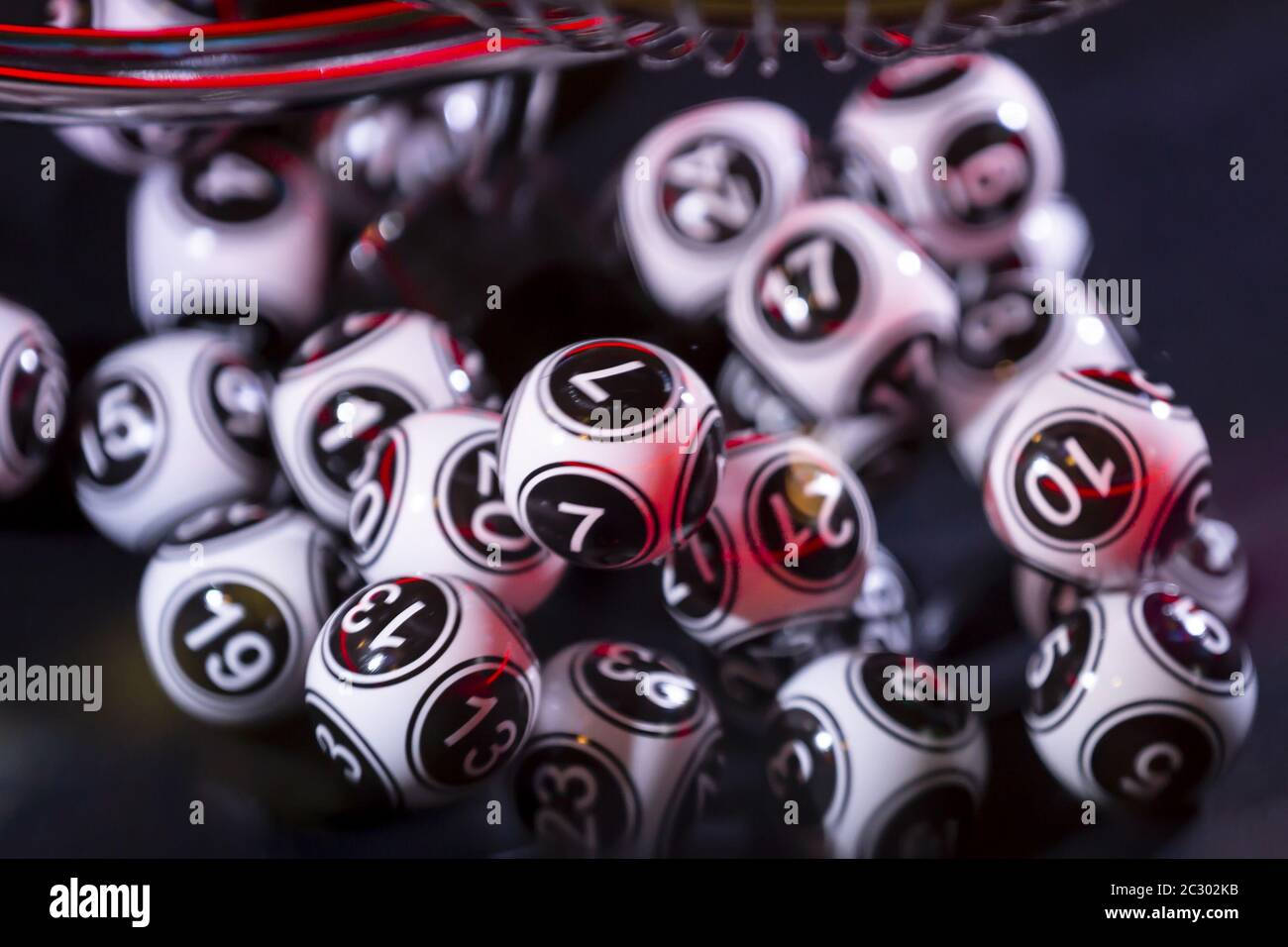 Black and white lottery balls in a machine 7 Stock Photo - Alamy