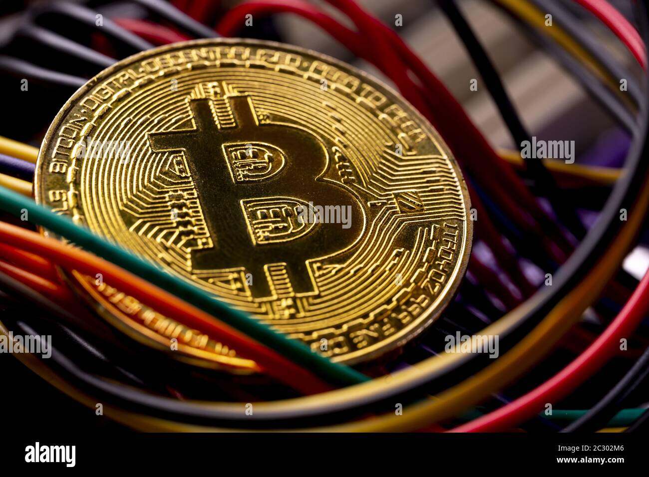 Bitcoin coin, colorful cables and printed circuit board PCB Stock Photo ...
