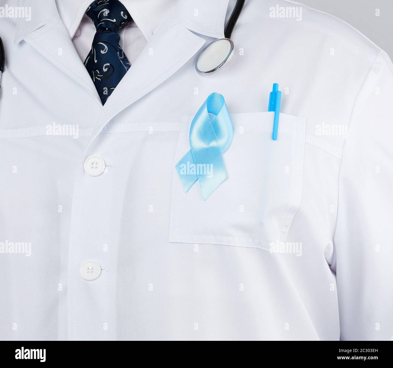 on the pocket pinned a blue ribbon in the shape of a loop, symbol of ...