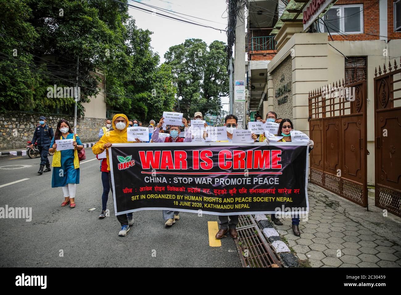 Activists affiliated with Human Rights and Peace Society Nepal hold a ...