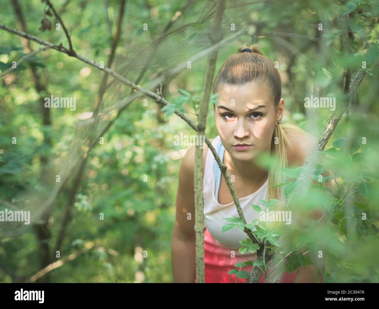 Young Blonde Caucasian Female Forest Runner Posing Stock Photo - Alamy