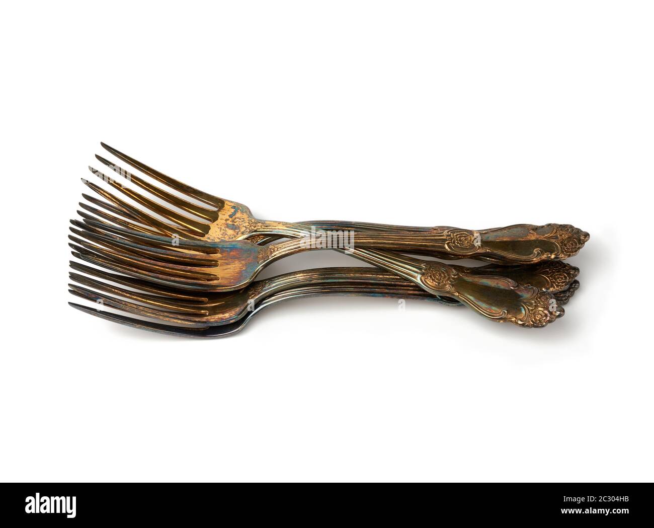 stack of vintage gilded forks isolated on white background, table ...