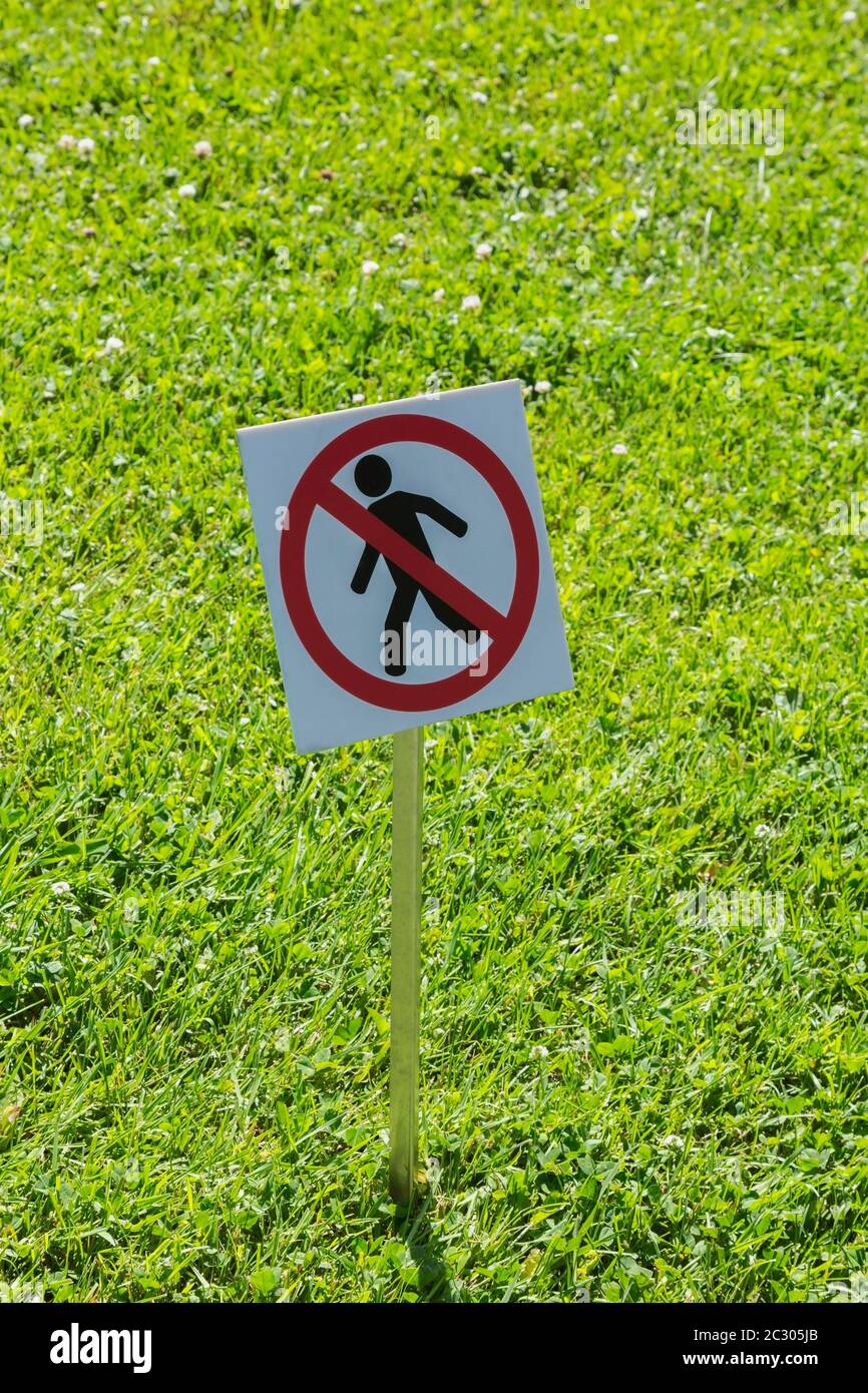 Do not walk on grass, prohibition sign on green grass, pictogram ...
