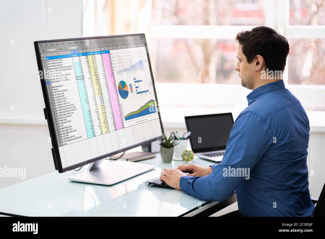 Young man working on spreadsheet hi-res stock photography and images ...