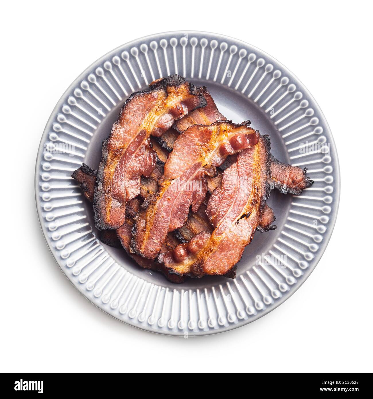 Fried bacon on plate. Sliced roasted bacon isolated on white background ...