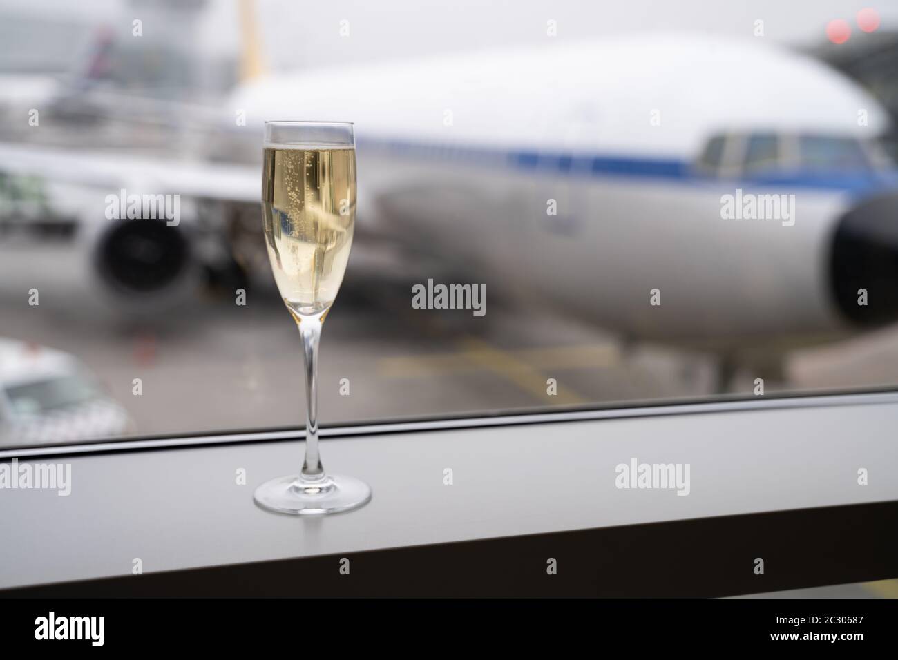 Champagne Glass In Airport Before Boarding Airplane Flight Stock Photo ...