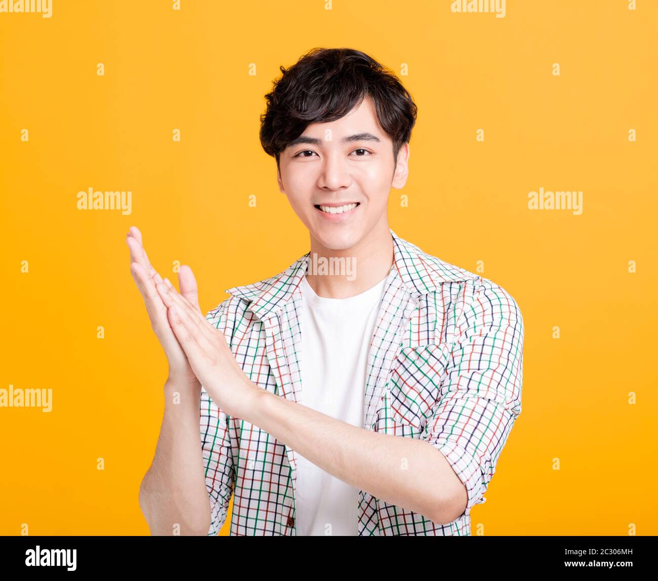 smiling asian young man Clapping and applauding Stock Photo - Alamy