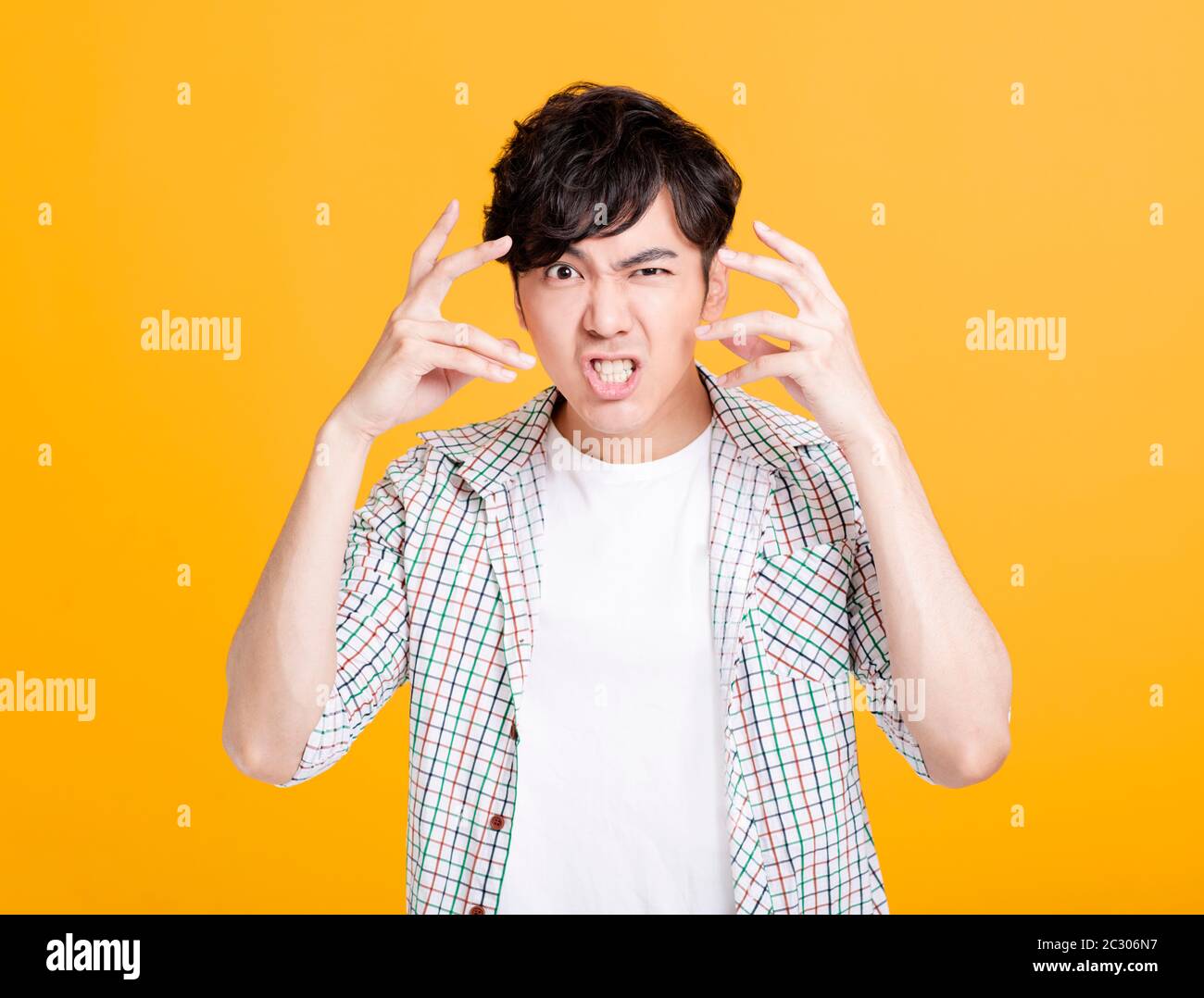 portrait of angry asian young man Stock Photo - Alamy