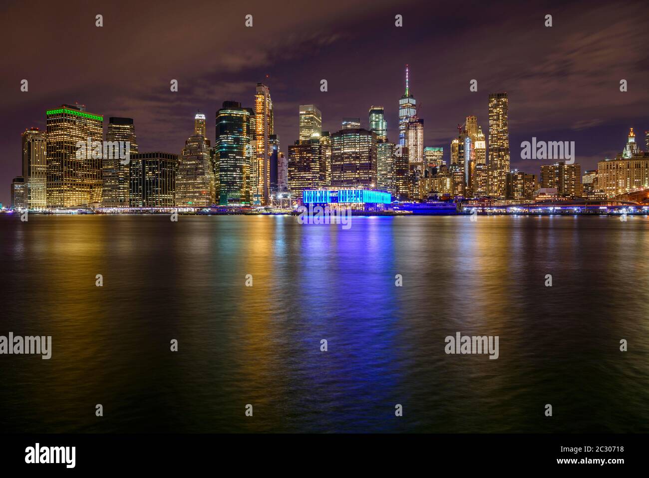 View from Pier 1 at night over the East River to the skyline of lower ...