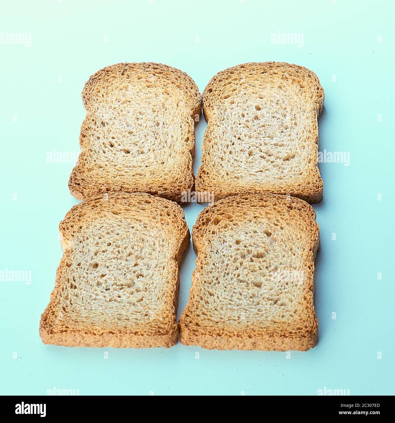 Four toast isolated on blue bakcground. Healthy concept Stock Photo - Alamy