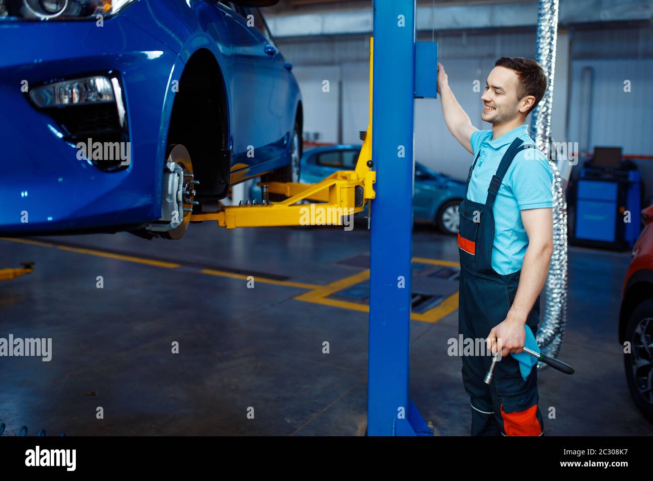 Man Lifts Car High Resolution Stock Photography and Images - Alamy