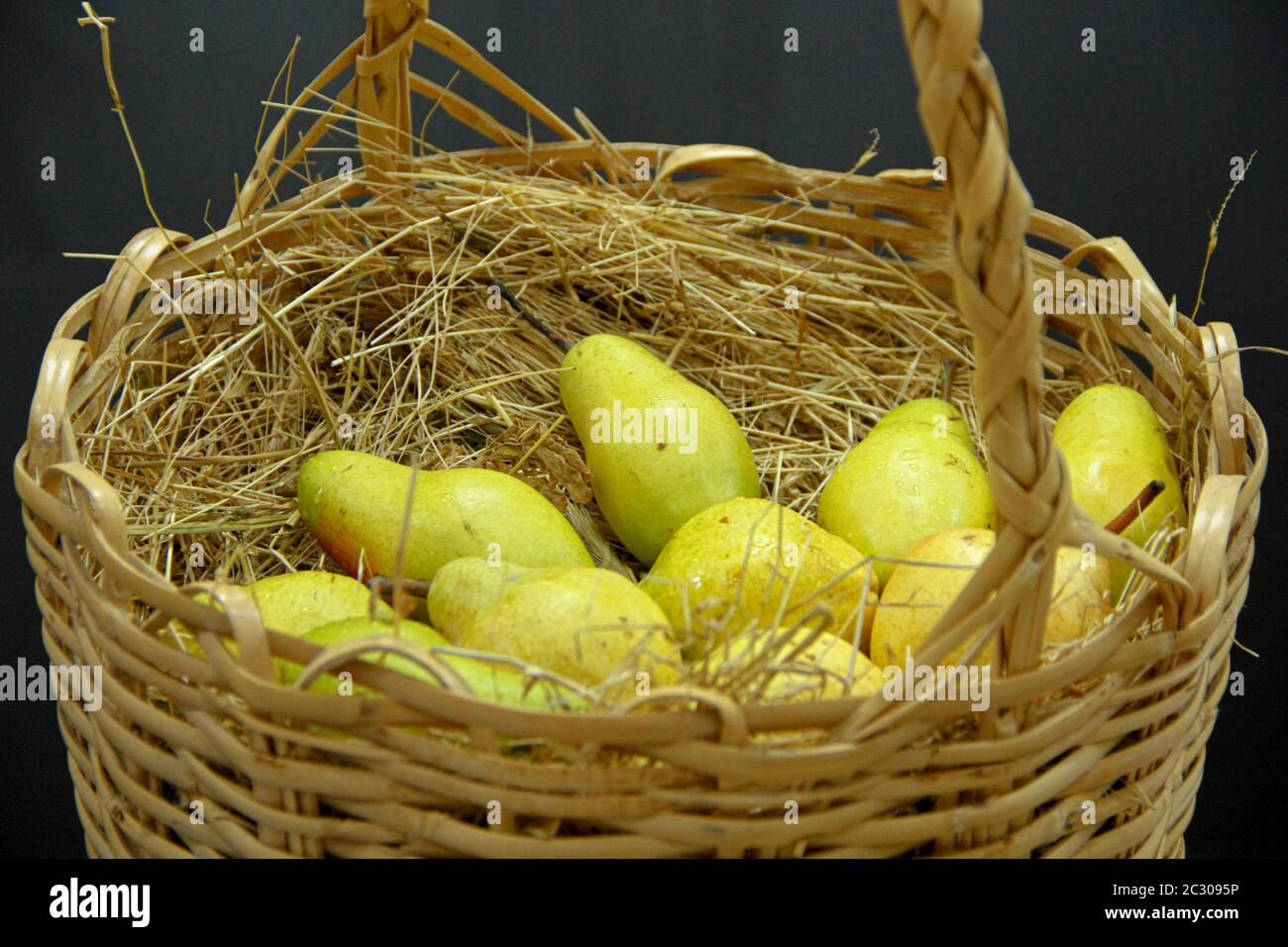 Yellow pears inside bamboo basket Stock Photo - Alamy