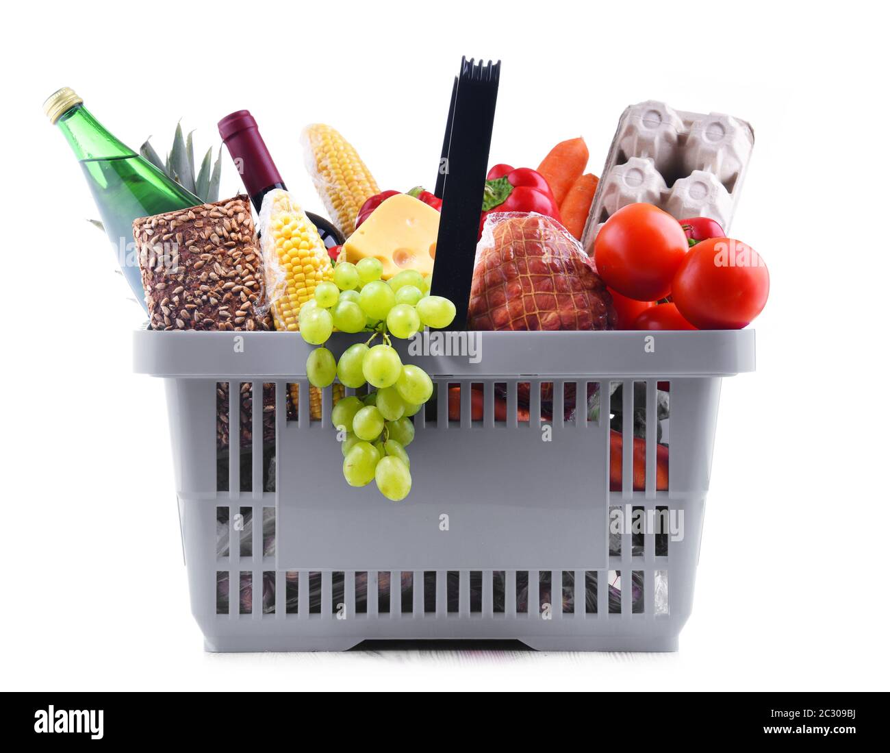 Plastic shopping basket with assorted grocery products isolated on ...