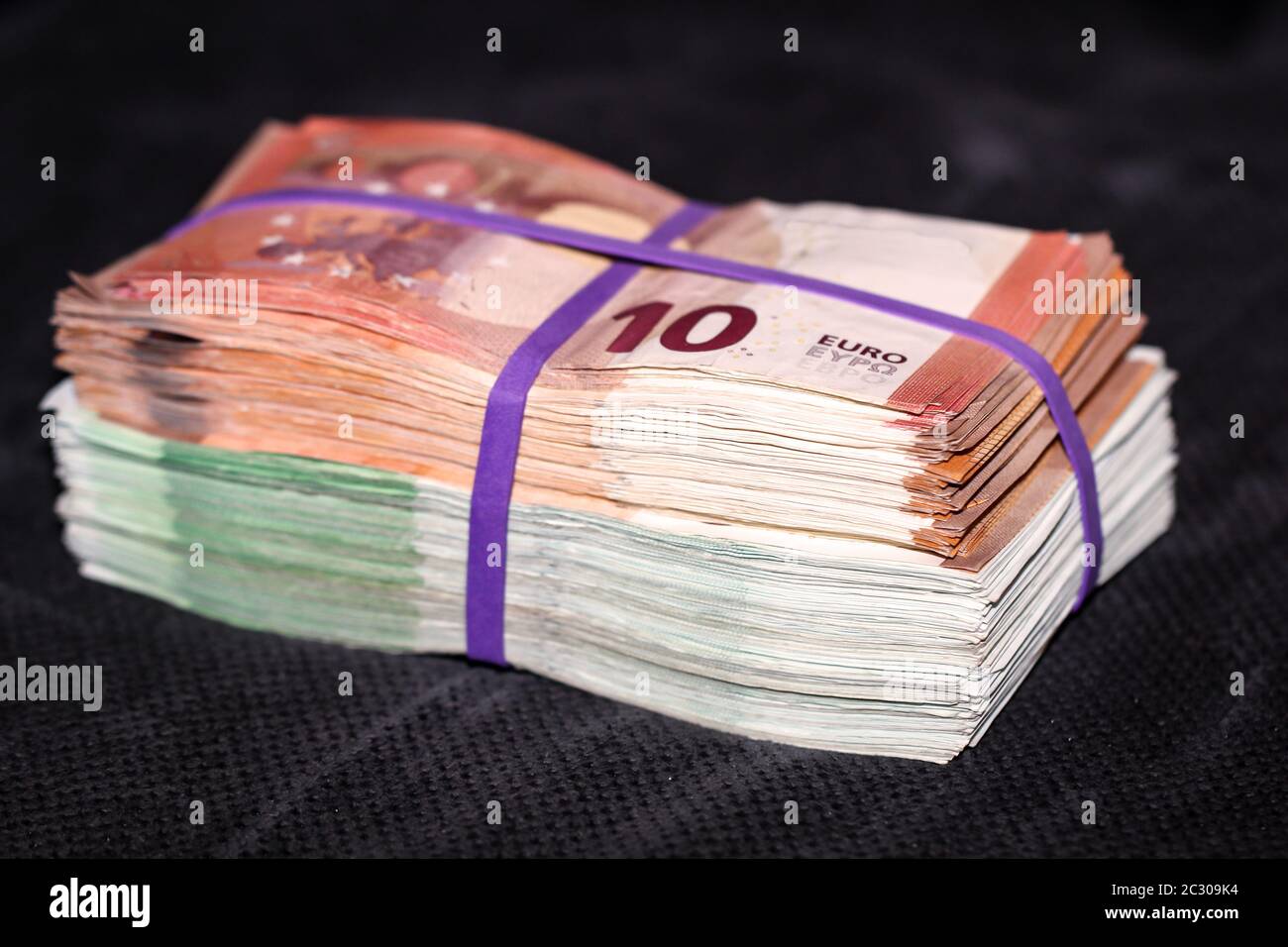 several thousand euros in banknotes, banknotes bundled on a pile Stock ...