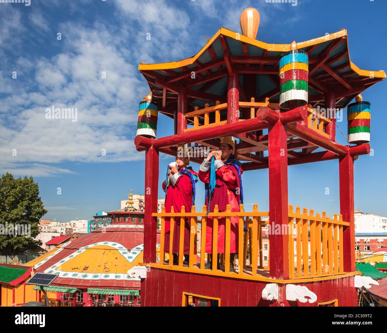 The morning signal for opening monastery, Monks using shell trumpet for ...