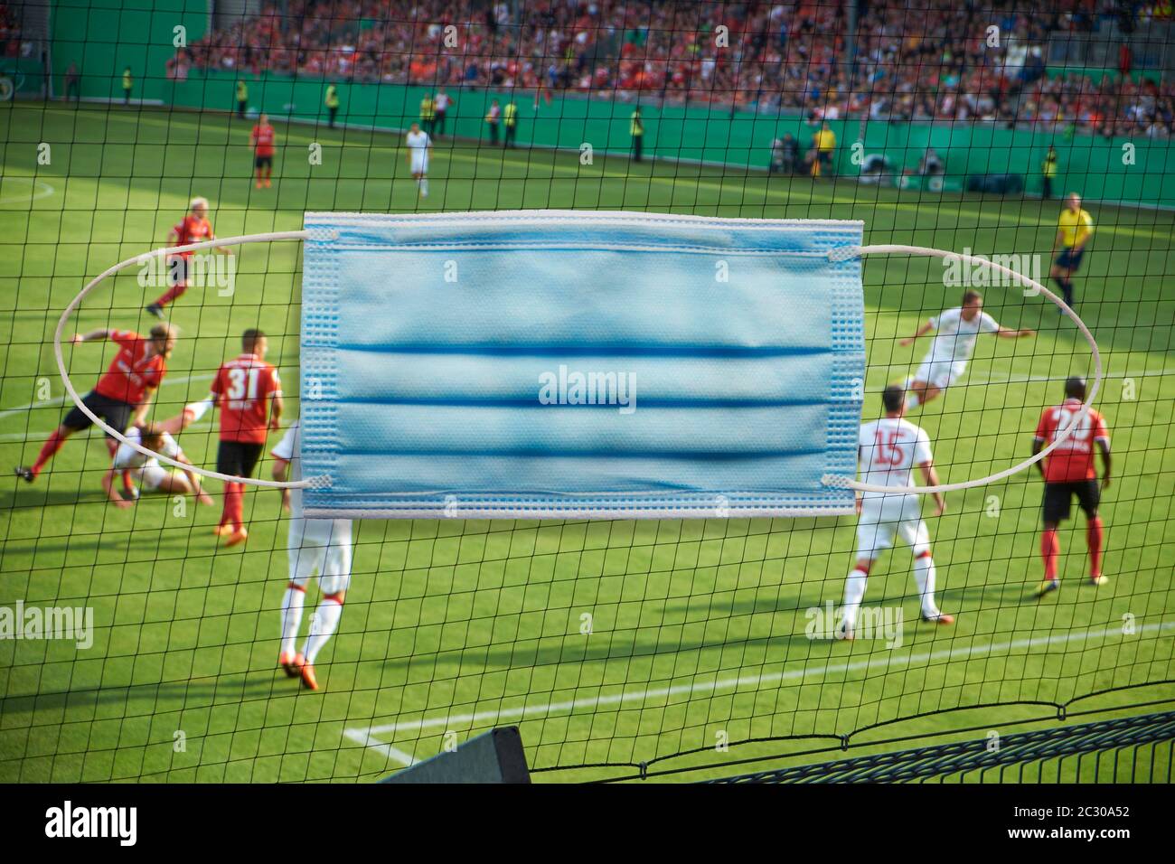 Digital Composing, Protective mask, football game during corona ...