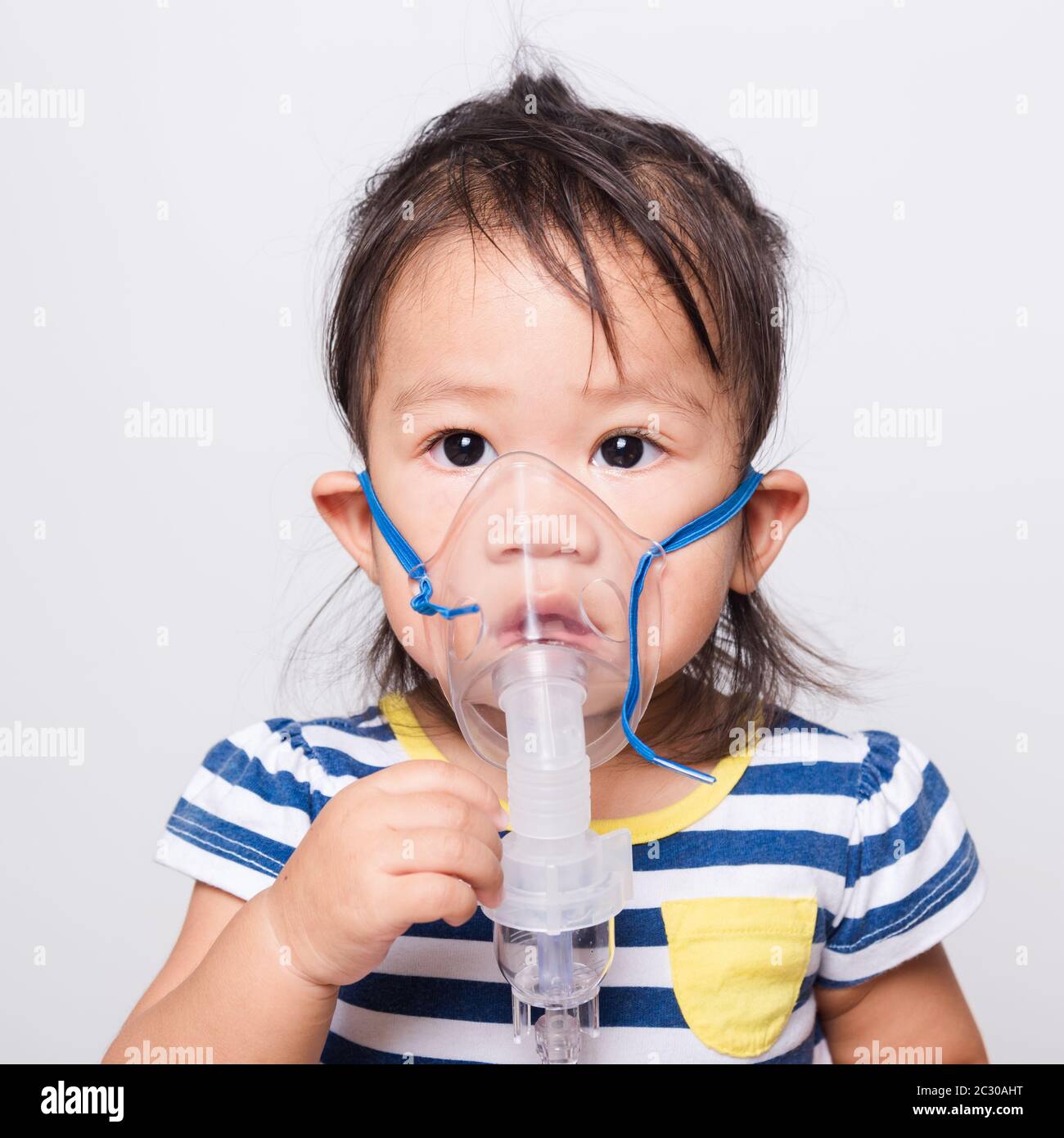 Closeup Asian face, Little baby girl sick her using steam inhaler ...