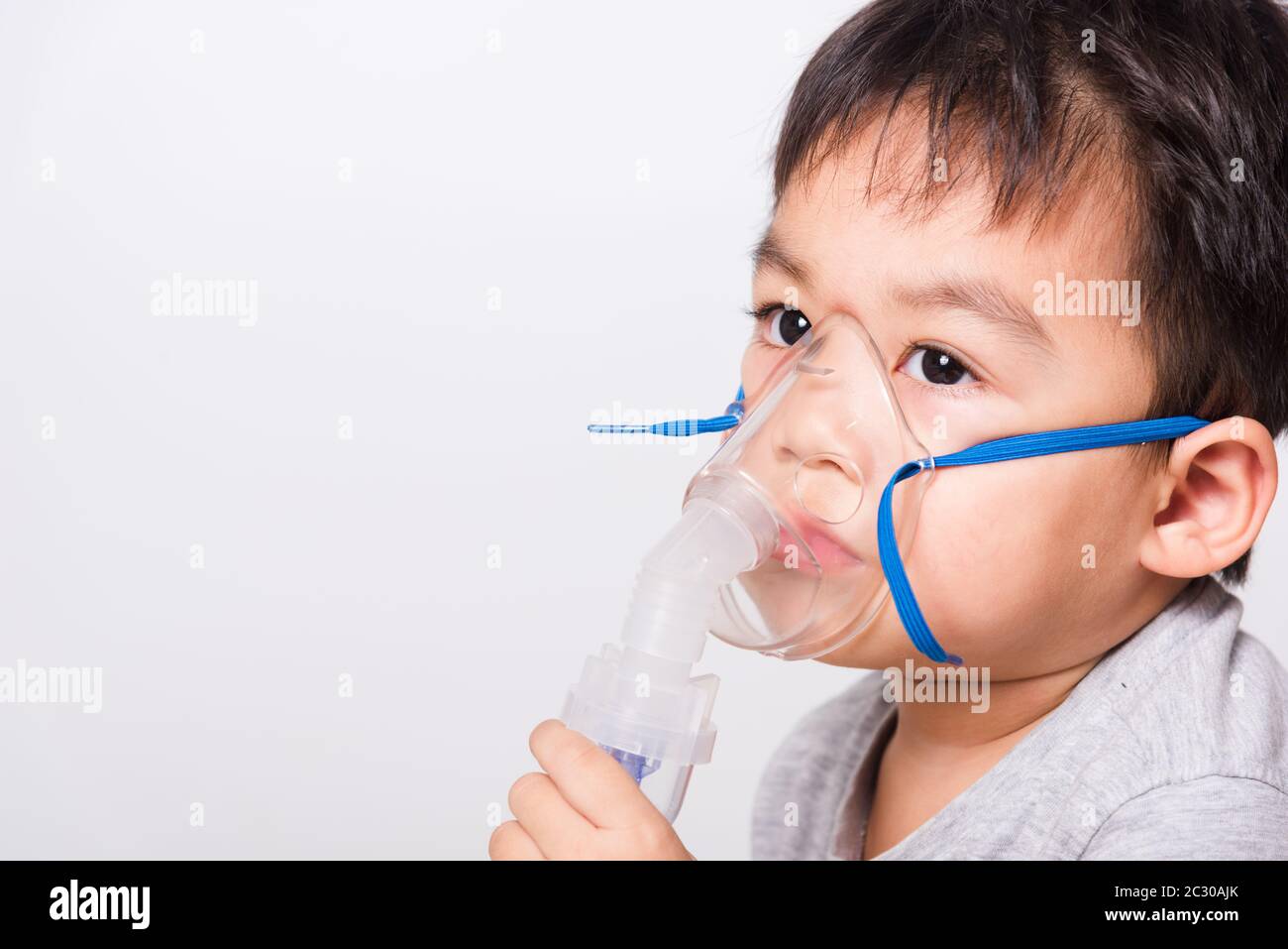 Closeup Asian face, Little children boy sick he using steam inhaler ...