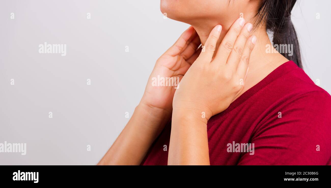 Asian beautiful woman itching her scratching her itchy neck on white ...