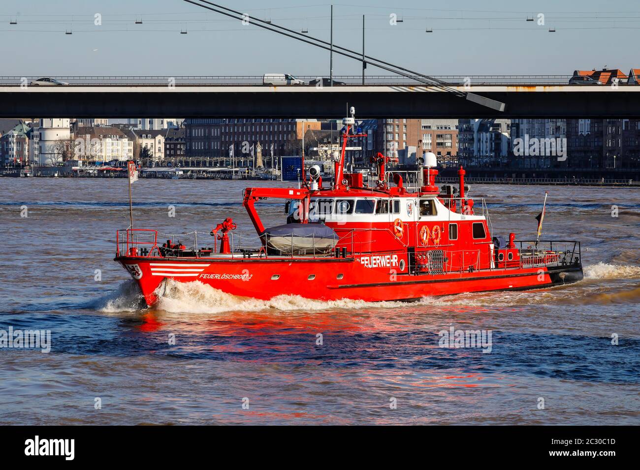 Fireboat navigates on the Rhine during floods under the Rhine knee ...