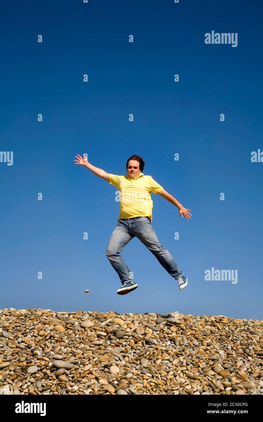 Beach exercise jumps man hi-res stock photography and images - Alamy