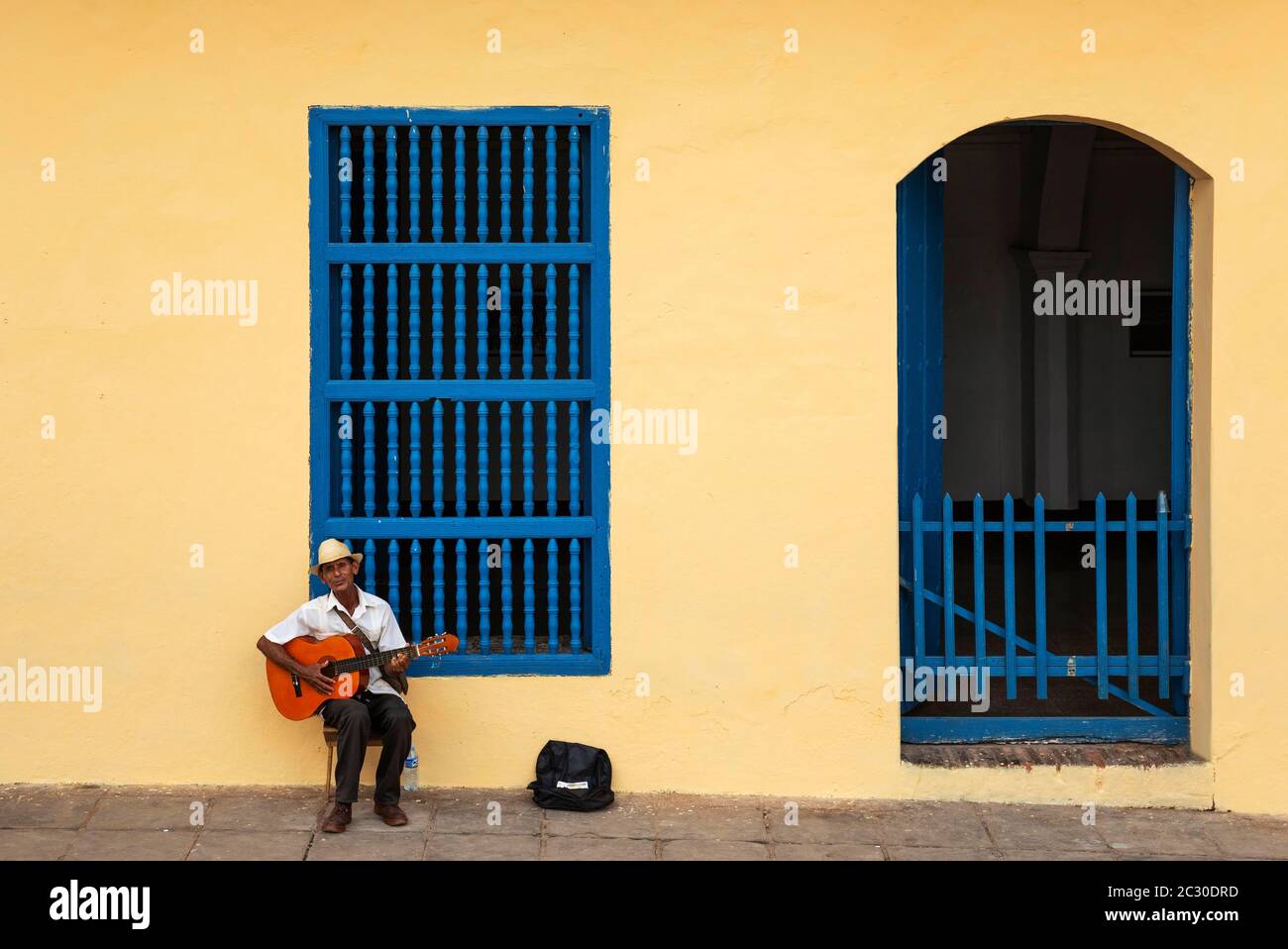 Busker at the restored colonial building of the Benito Ortiz Art ...