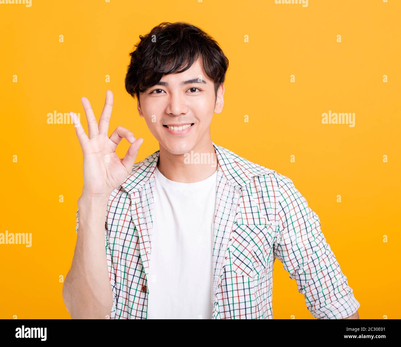 young man hand showing ok sign Stock Photo - Alamy