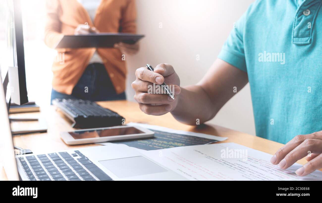 Asian team Outsource Developer Looking Screen Programming Code Working ...