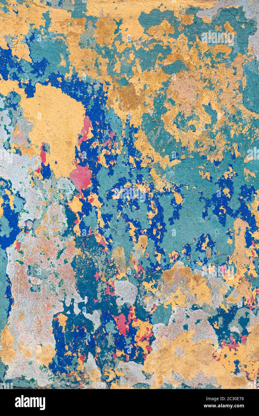 Colours, shapes and textures at the crumbling plaster of a decayed wall ...