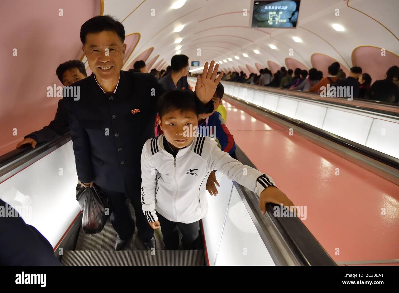 Pyongyang, North Korea - May 1, 2019: People on the escalator of the ...