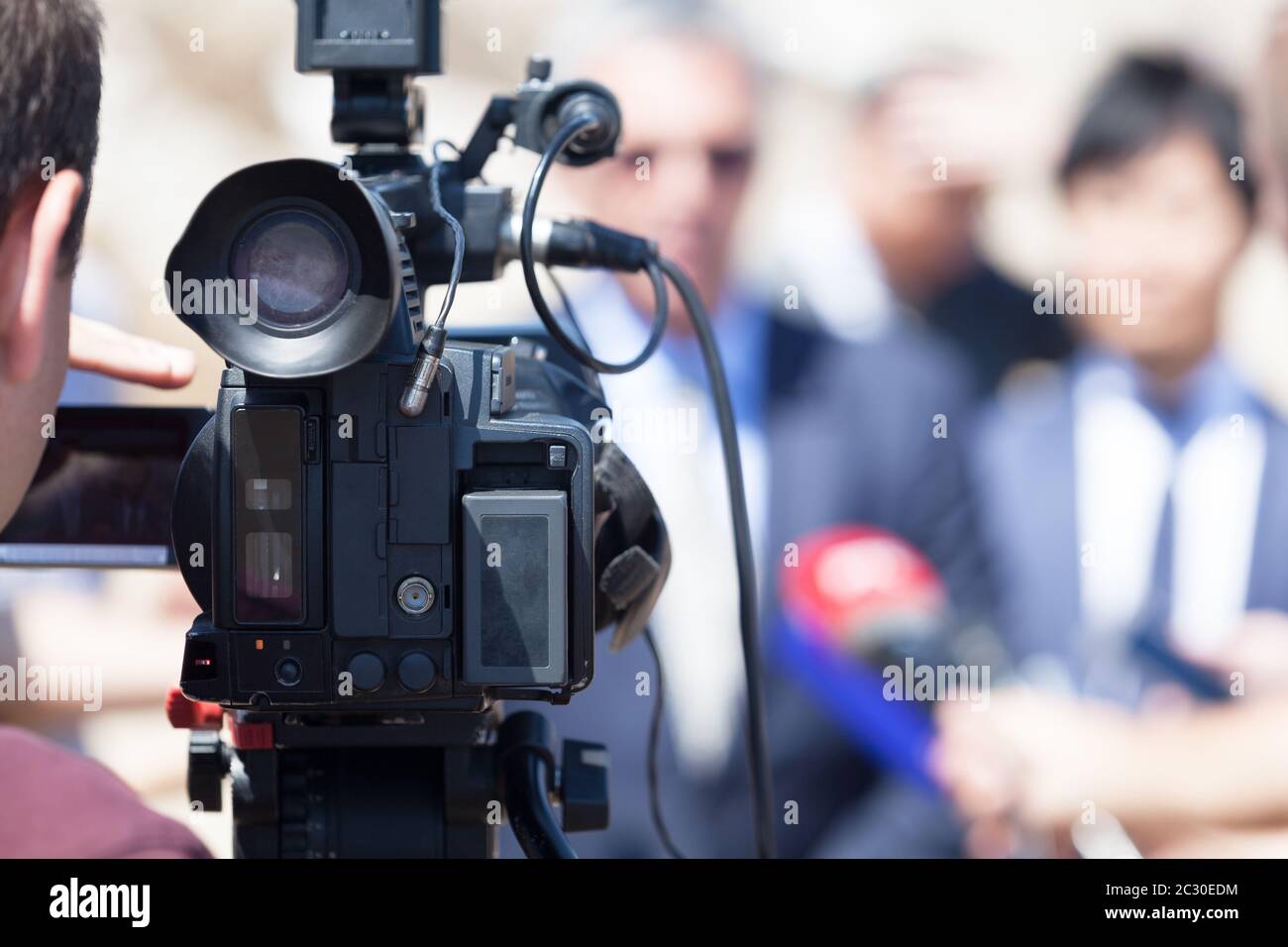 Filming news conference with video camera Stock Photo - Alamy