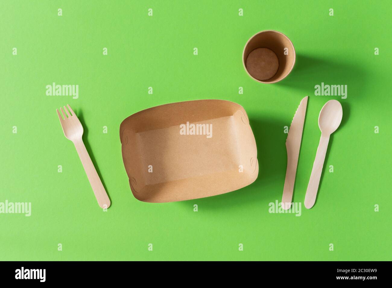 Eco friendly disposable dishes, glass with a plate and cutlery of ...