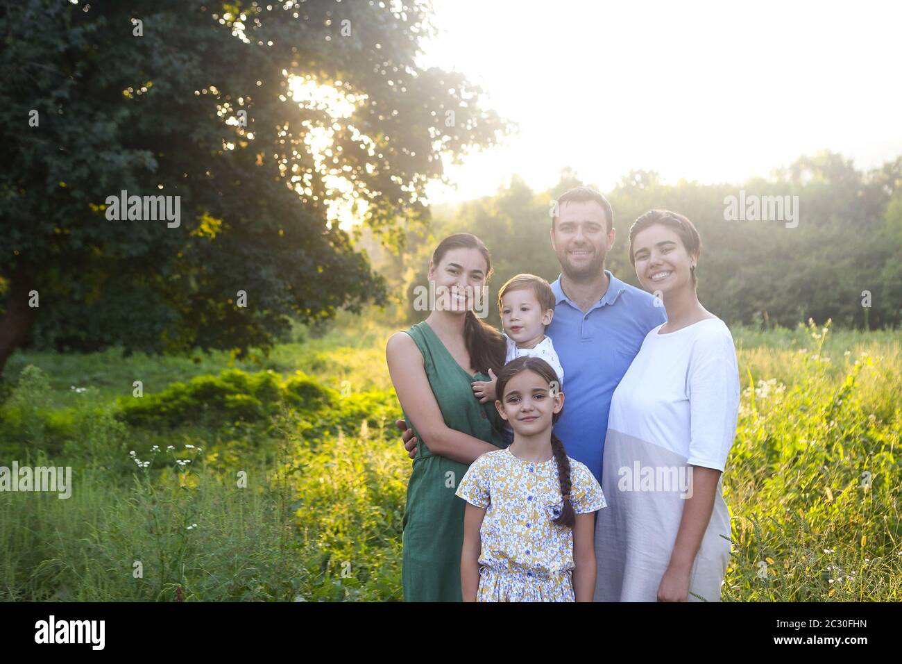 Parents with children in countryside outdoors Stock Photo - Alamy